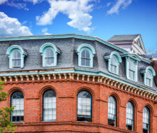 Mansard Roof Guide: Costs, Types, Pros, and Cons